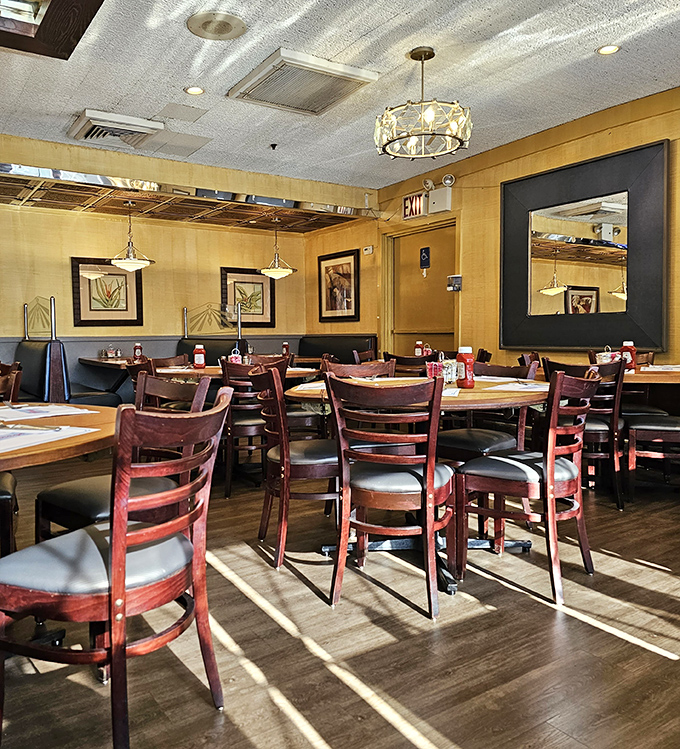 Warm wood tones, comfortable booths, and pendant lighting create that perfect "everybody knows your name" atmosphere. Nostalgia you can sit in.