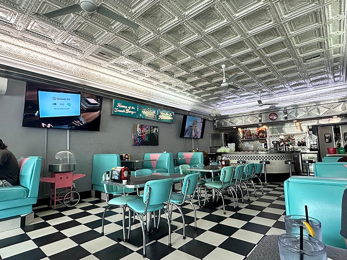 Step inside and the 1950s never ended &ndash; turquoise booths, checkered floors, and that magnificent tin ceiling create diner perfection that Instagram filters wish they could replicate.