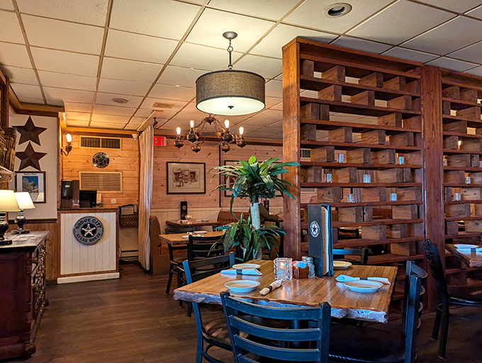Wooden dividers and live plants create semi-private dining spaces, striking that perfect balance between cozy intimacy and lively restaurant energy.