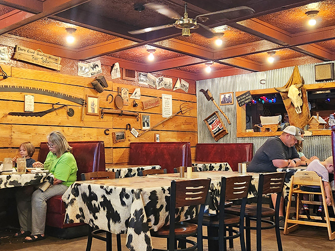 Cowhide tablecloths and wooden walls create the perfect backdrop for serious steak consumption. This isn't d&eacute;cor&mdash;it's a mission statement.