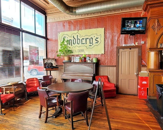 Those vintage red chairs aren't just seating&mdash;they're front-row tickets to a comfort food symphony conducted in a space that whispers stories.