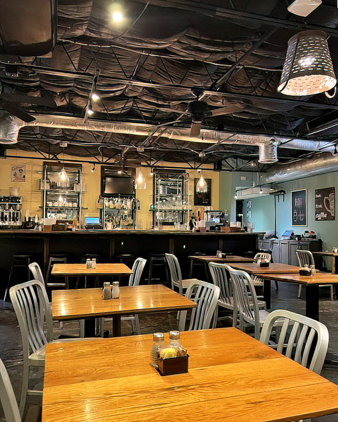 Industrial-chic meets Southern comfort in this dining room where wooden tables and metal chairs create the perfect canvas for breakfast masterpieces.