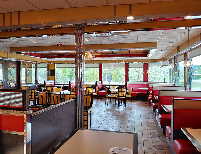 Red vinyl booths and chrome accents aren't just design choices—they're a promise that whatever food arrives will taste exactly like your fondest childhood memory.