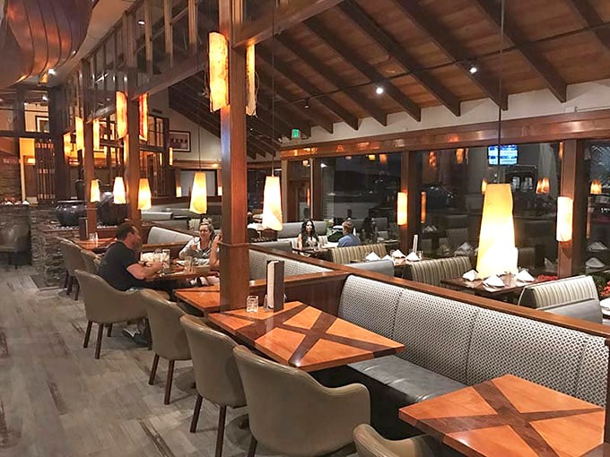 Warm wood beams, ambient lighting, and water views from every table&mdash;this isn't just dinner, it's Pacific Northwest theater.