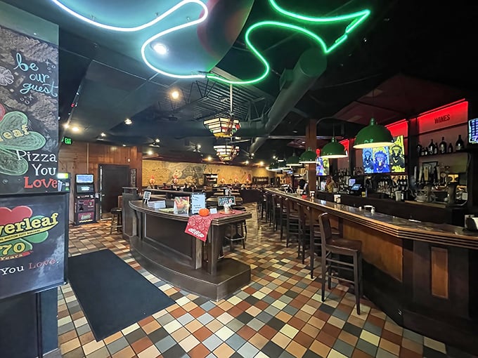 The bar area glows with neon charm, where locals gather to debate Lions' prospects while waiting for pizza perfection.
