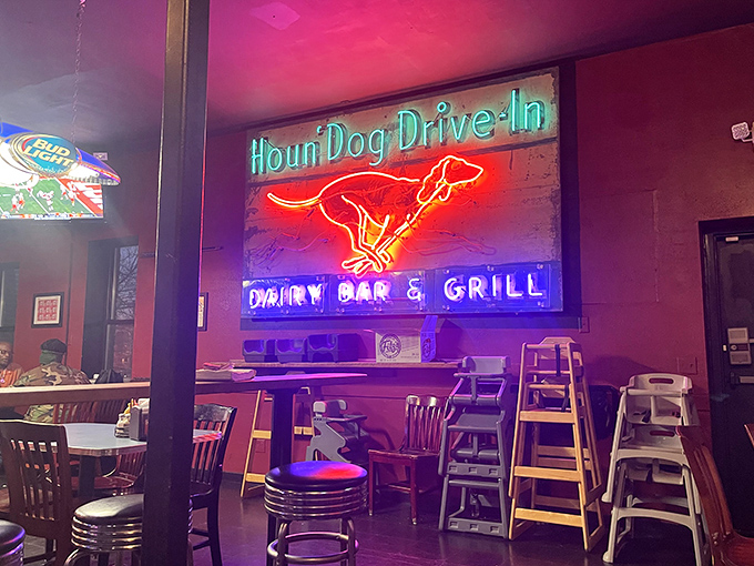 Vintage neon signs cast a nostalgic glow inside Fitz's, where the Houn'Dog Drive-In sign reminds us that good food never goes out of style.