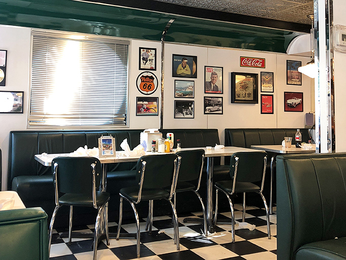Classic black and white checkered floors meet forest green booths in this time capsule of Americana where every seat feels like the best in the house.