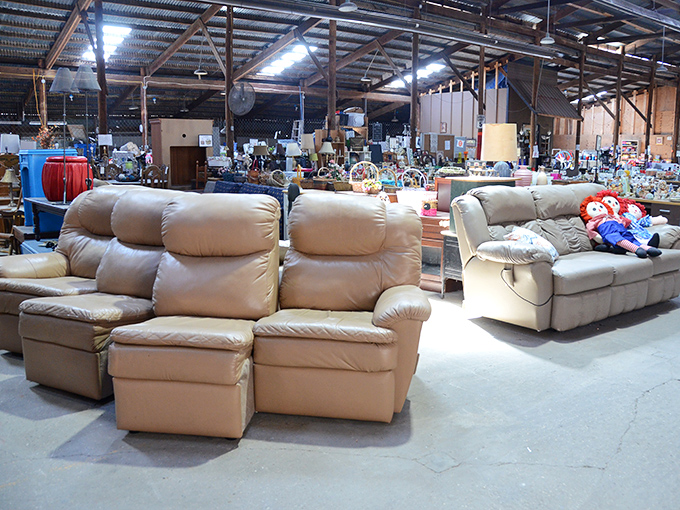 A sea of comfortable seating options stretches across the warehouse floor&mdash;each couch with its own story and ready for its next chapter.