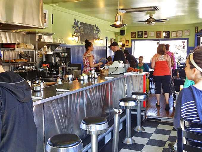 Where stainless steel meets mint green walls, Morning Glory's counter seating offers front-row tickets to the breakfast ballet. Kitchen theater at its finest.