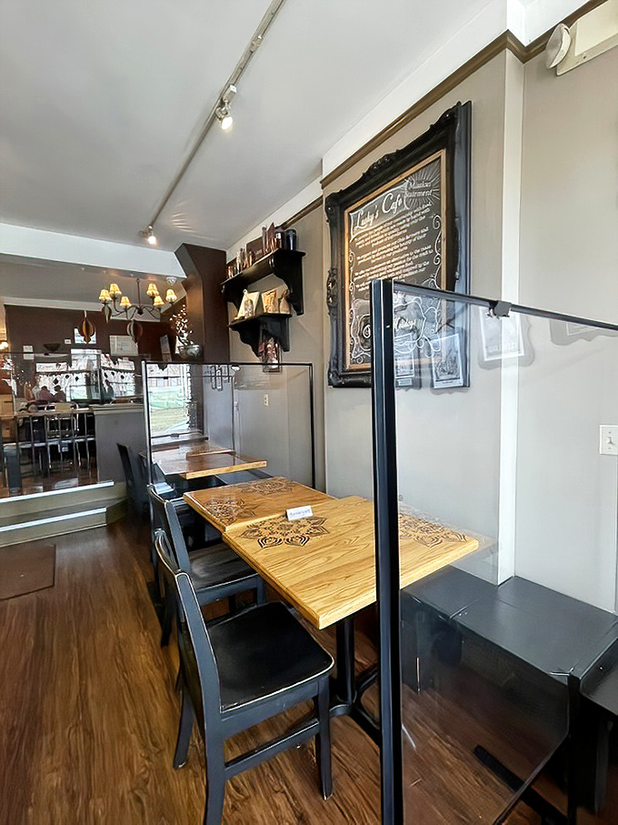 Wooden tables bathed in natural light create that rare atmosphere where both first dates and family reunions feel equally at home.
