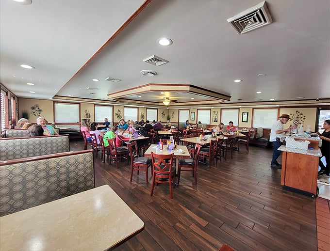 The warm wood tones and comfortable booths create that perfect diner atmosphere where strangers become neighbors and calories don't count before noon.