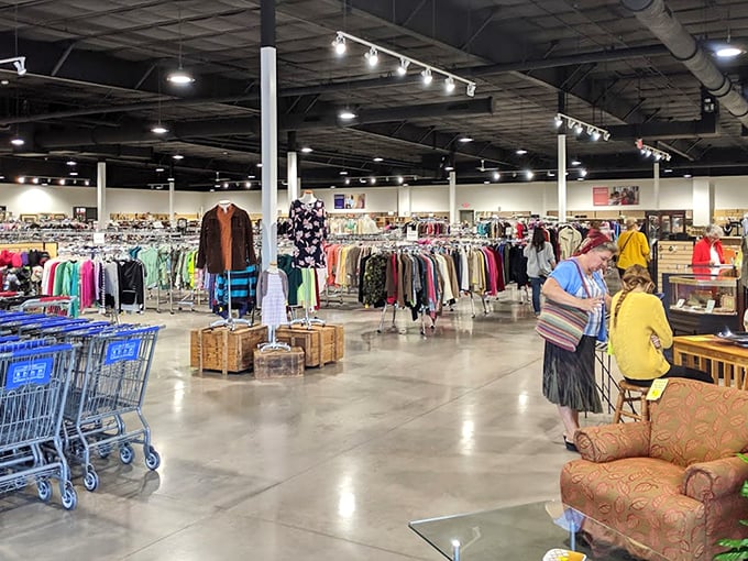 Endless racks stretch toward the horizon in this thrifter's paradise. The polished concrete floors have witnessed countless "eureka" moments of discovery.
