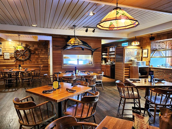 Wooden ship wheels and stained-glass lamps transform this mountain restaurant into a cozy maritime haven where seafood dreams come true.