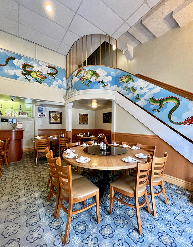 Dragons dance along the stairway walls, watching over diners as they feast. This round table setup practically begs for family-style ordering and animated conversation.