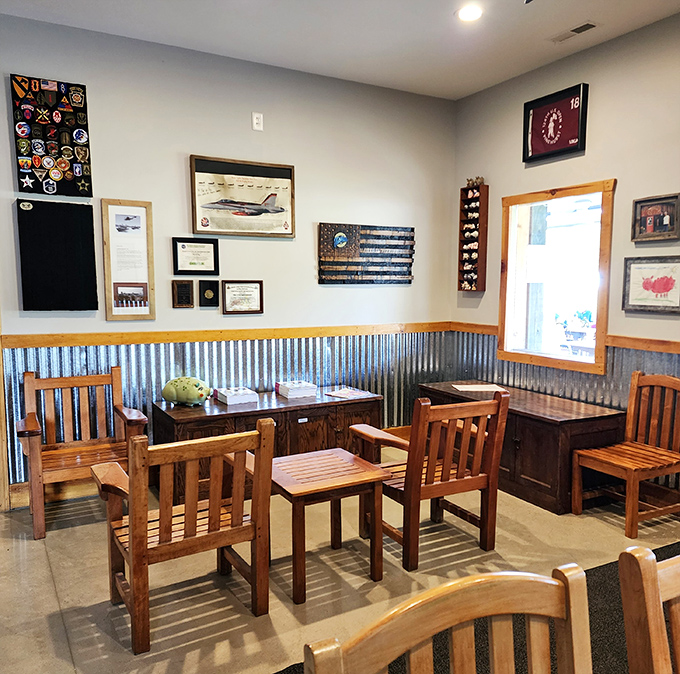 Aviation meets appetite inside, where corrugated metal wainscoting and wooden chairs create the perfect landing spot for serious barbecue business.