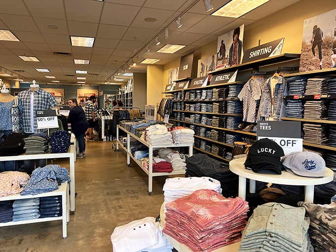 Retail paradise awaits as shoppers browse neatly arranged displays of casual wear, where "50% OFF" signs beckon like old friends inviting you to indulge.