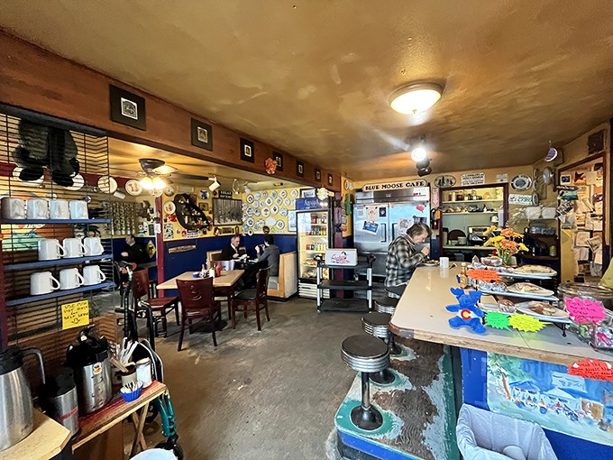 Inside, every inch tells a story &ndash; mismatched mugs, wood-paneled walls, and the kind of cozy chaos that says "the food matters more than the decor."