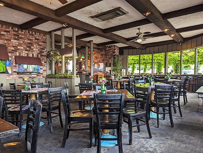 Exposed brick, wooden beams, and natural light&mdash;this dining room feels like the galley of a well-loved ship that decided to drop anchor permanently.