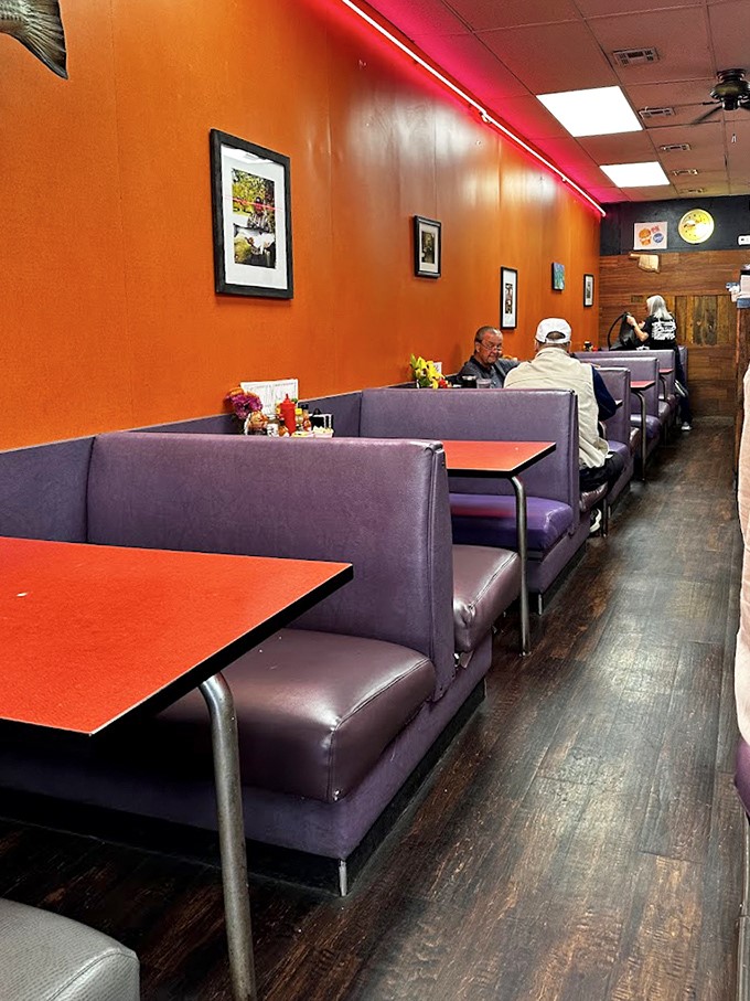 Purple vinyl booths and orange walls create the perfect backdrop for morning philosophizing. Comfort doesn't need to be complicated.