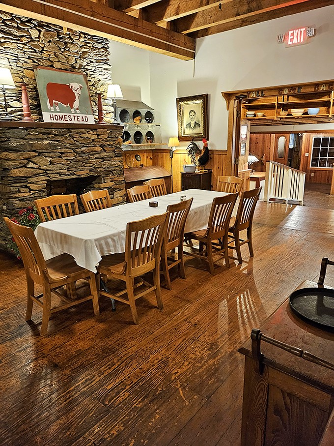 Rustic stone fireplace, wooden beams, and country charm create the perfect backdrop for serious steak consumption. Comfort never looked so inviting.