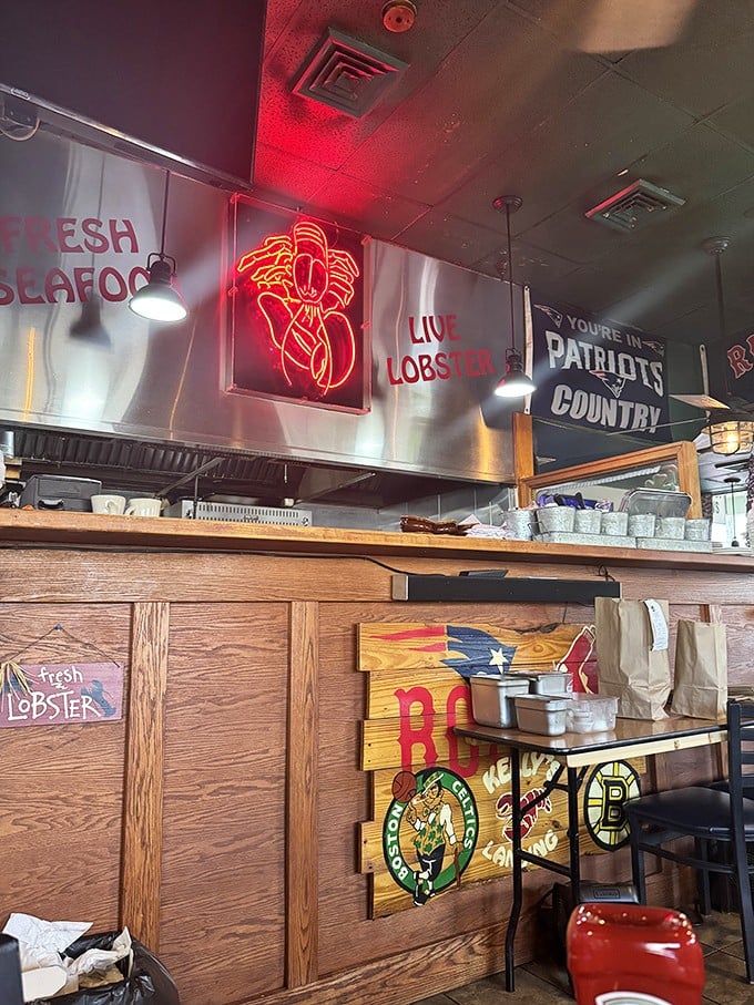 Boston sports memorabilia and a glowing lobster sign announce you're in Patriots territory now. The neon practically whispers, "Order the seafood, ya chowderhead!"