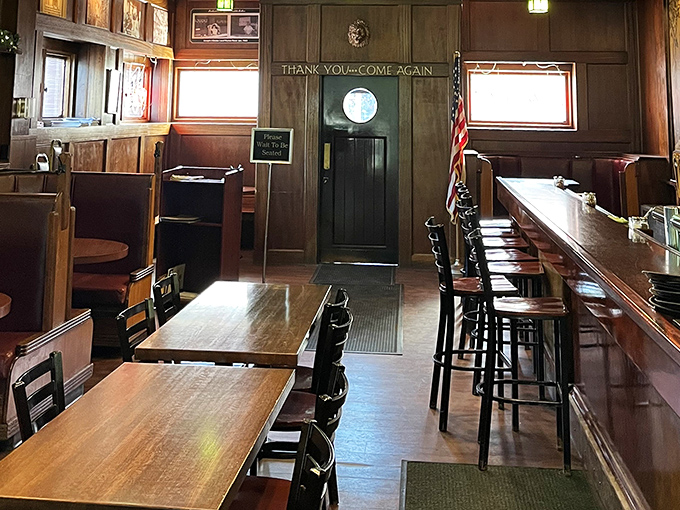 Wood-paneled walls tell stories of decades past, while the "Thank You Come Again" sign makes a confident prediction you'll happily fulfill.