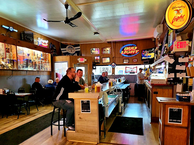 Inside, wood paneling and neon beer signs create the perfect time capsule &ndash; a place where conversations flow as freely as the drinks.
