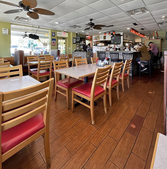 Classic diner charm with wooden chairs and red cushions&mdash;where conversations flow as freely as the coffee, and breakfast dreams come true.