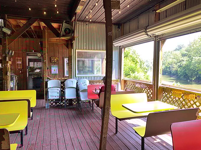 The riverside deck offers yellow tables with a view that rivals the food. Nature and barbecue&mdash;West Virginia's perfect pairing.