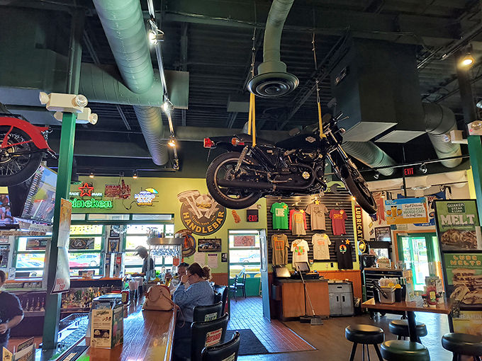 Where else can you dine beneath a suspended motorcycle? At Quaker Steak & Lube, the ceiling decor is as impressive as what's on your plate.