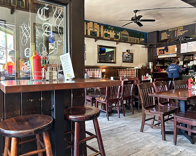 Wooden chairs, worn floors, and decades of character &ndash; Zip's interior feels like stepping into a time machine where burgers have always been king.