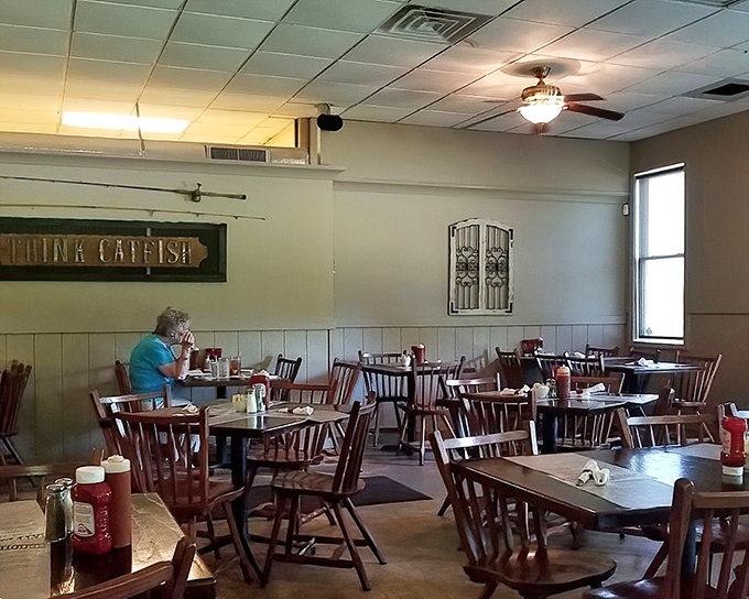 Simple wooden chairs and no-nonsense tables set the stage for a meal where the food, not the decor, takes center stage in this unpretentious dining room.