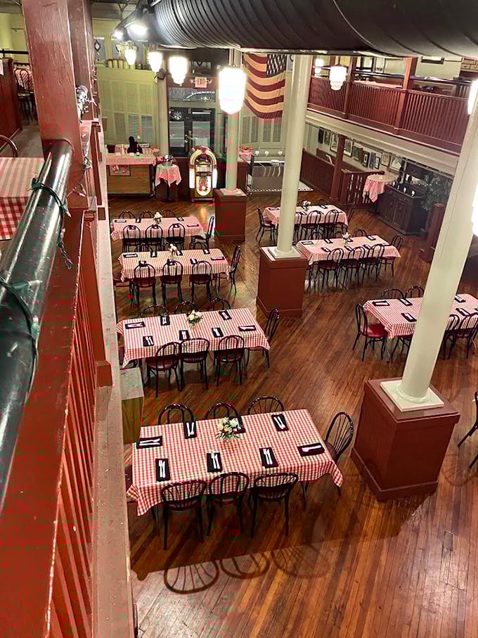 Red and white checkered tablecloths await the barbecue faithful. This dining room has hosted more memorable meals than most family dinner tables.