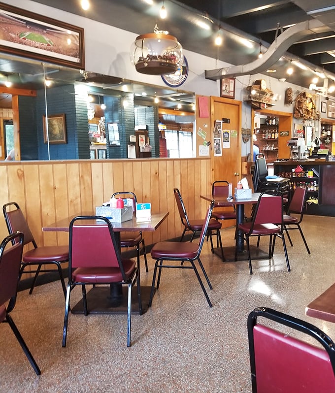 Inside, wood-paneled walls and burgundy chairs create that perfect "come as you are" atmosphere where memorable meals happen.