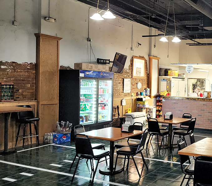 Inside, simplicity reigns supreme. Exposed brick walls and no-nonsense tables tell you immediately: this place prioritizes pizza perfection over pretentious d&eacute;cor.