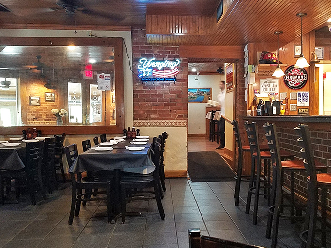 Cozy interior where brick walls and wooden ceilings create the perfect backdrop for serious eating business.