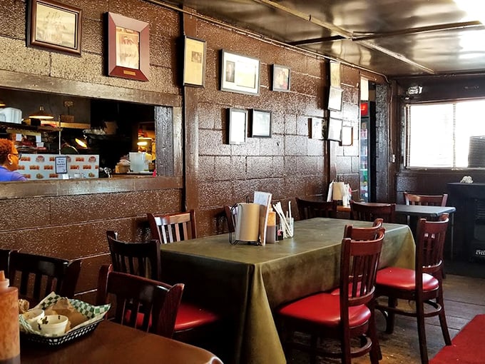 Inside Leo's, the wood-paneled walls and red-cushioned chairs tell stories of decades of satisfied diners and sauce-stained smiles.