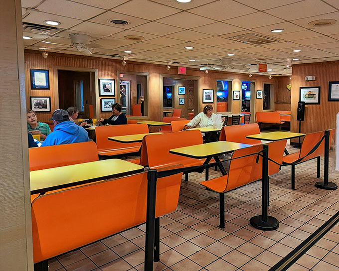 Orange booths that match the exterior create a cheerful, no-nonsense dining atmosphere where the focus remains squarely on the food.