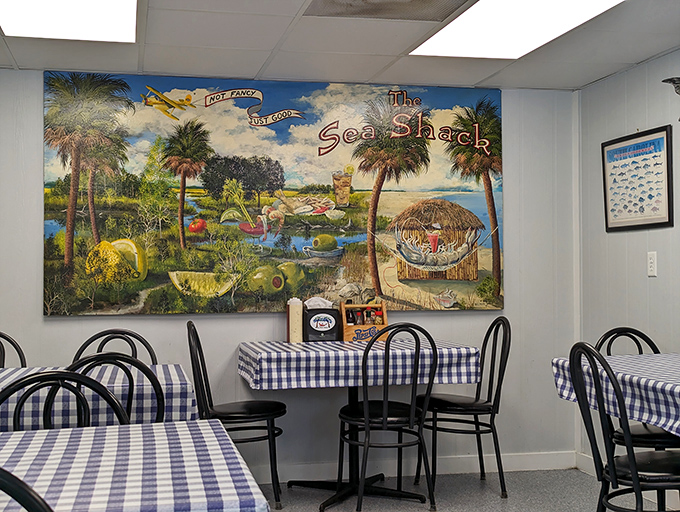 Blue checkered tablecloths and coastal artwork create the perfect backdrop for seafood magic. Like finding yourself in a delicious time capsule where calories don't count.