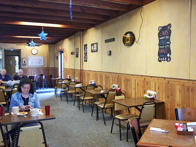 Inside, wood-paneled walls and simple furnishings create that perfect "everybody knows your name" atmosphere. Comfort begins before the food arrives.