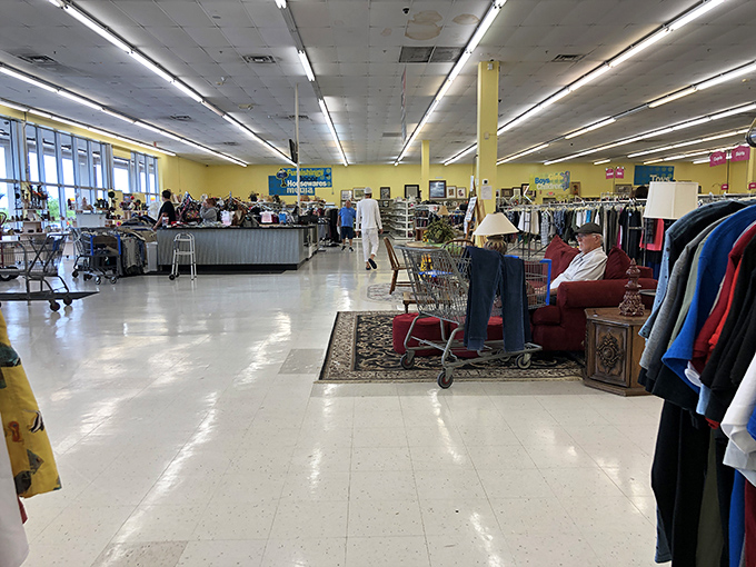 Fluorescent lights illuminate a wonderland of possibilities. That furniture vignette isn't just selling chairs&mdash;it's selling dreams of cozy reading nooks.