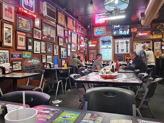 Where neon signs glow, memories hang on every wall, and the checkerboard tables have witnessed more burger victories than defeats.