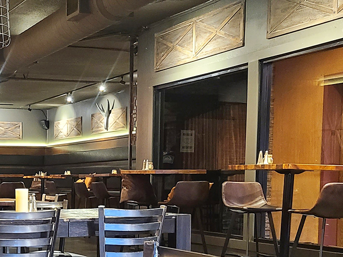 Industrial meets cozy in this thoughtfully designed interior where leather chairs invite you to settle in for a serious meat meditation.