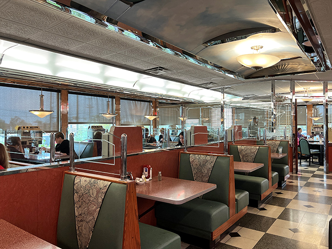 The interior is a symphony of vintage Americana&mdash;red vinyl booths, chrome accents, and that unmistakable checkerboard floor where countless coffee cups have been refilled.