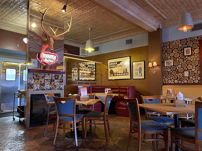Rustic meets refined in this wood-adorned dining room where antlers and vintage signs create the perfect backdrop for the meat-centric magic about to unfold.