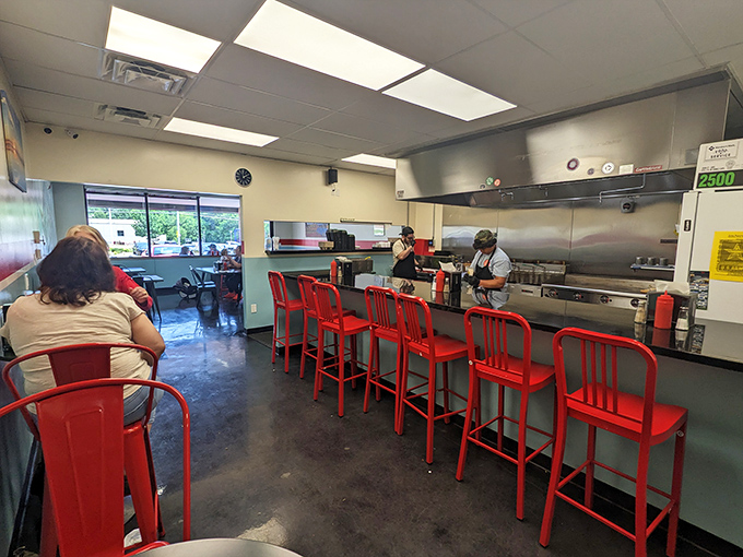 Red stools at the counter offer front-row seats to the culinary show, where kitchen magic happens right before your eyes. No smoke, no mirrors, just honest cooking.