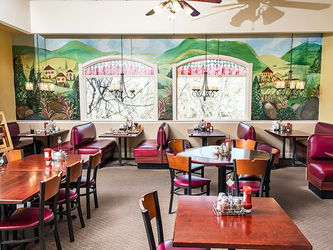 Inside, burgundy booths and hand-painted murals create a warm atmosphere where time slows down just enough for you to savor every bite of Italian-American goodness.