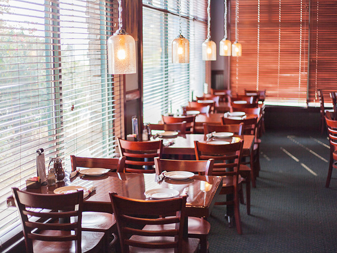 Warm wooden tables bathed in natural light create that "just right" atmosphere&mdash;not too fancy, not too casual, but perfectly comfortable for serious eating.