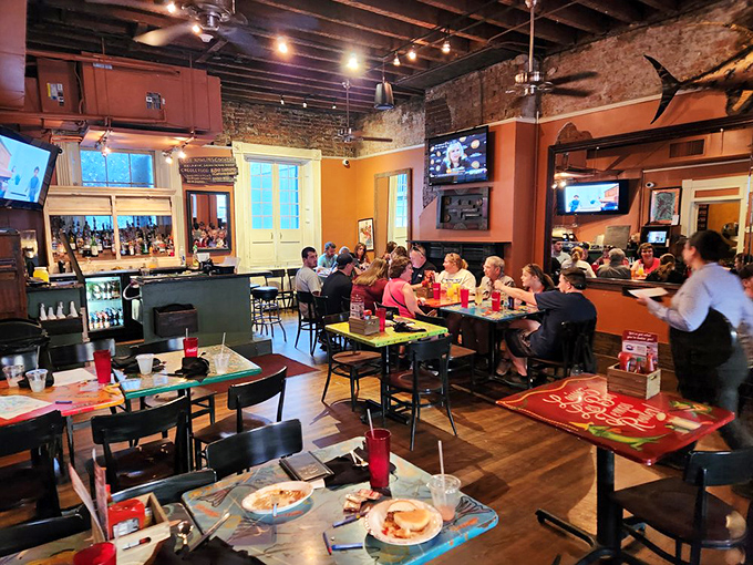 Inside, exposed brick walls and wooden beams create the perfect backdrop for the culinary magic that unfolds at every table.