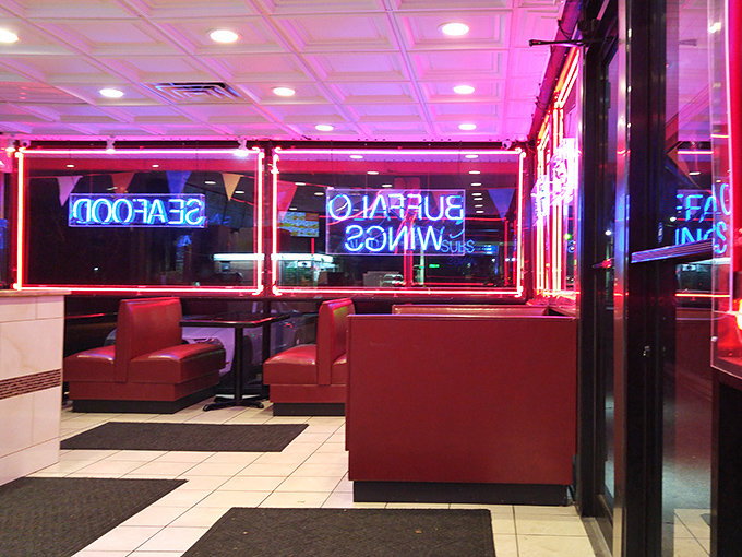 Red booths and neon signs create that perfect no-frills atmosphere where the food, not the decor, does all the talking.